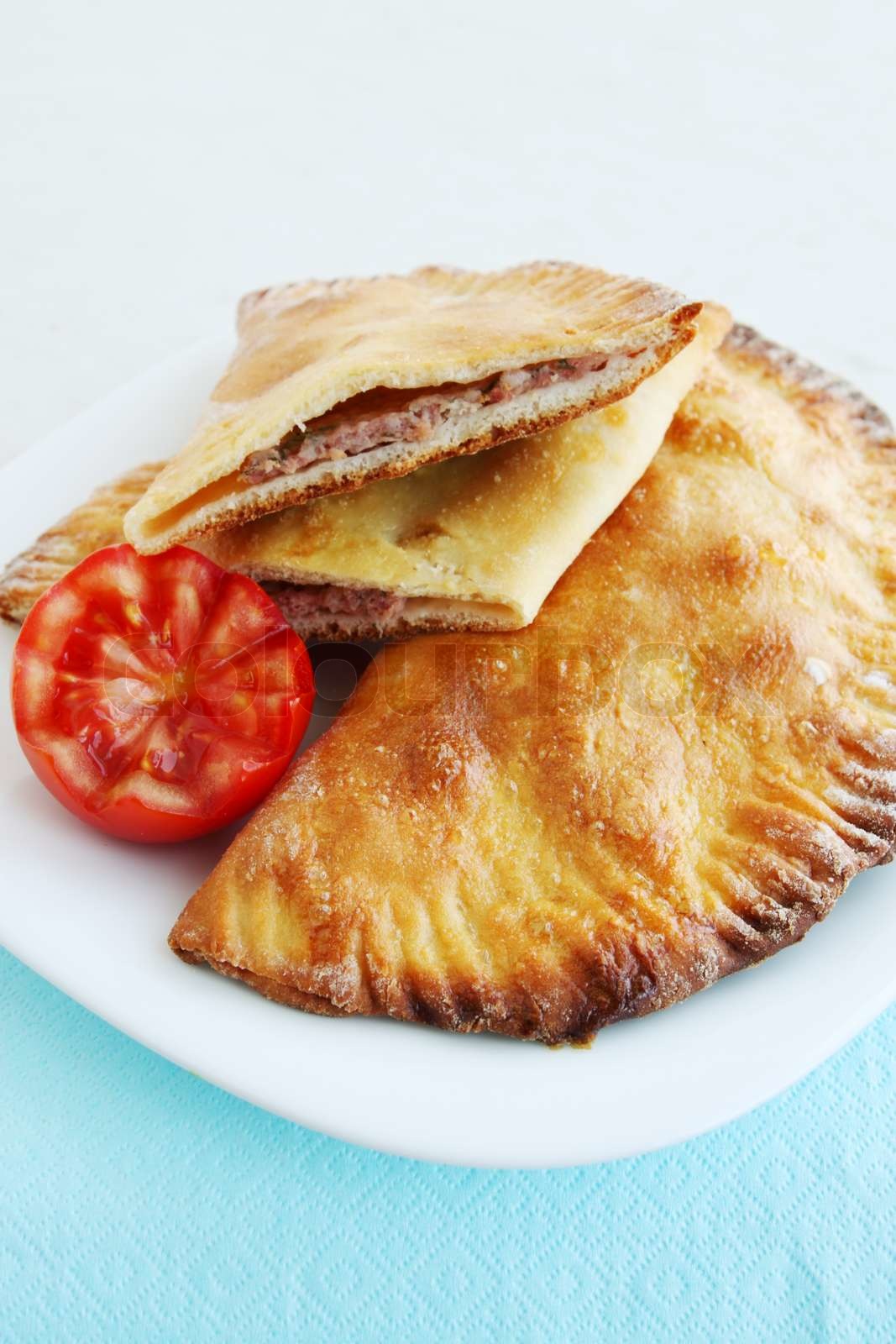 Fried cheburek with tomato | Stock image | Colourbox