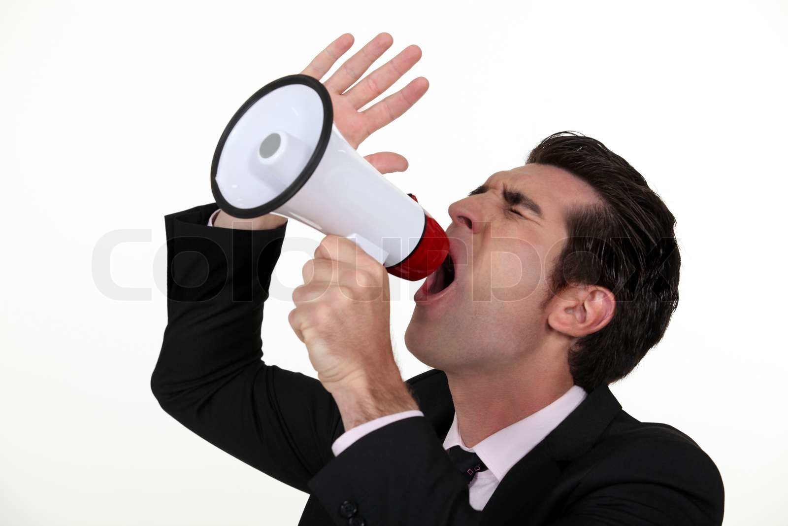 Man shouting through megaphone | Stock image | Colourbox