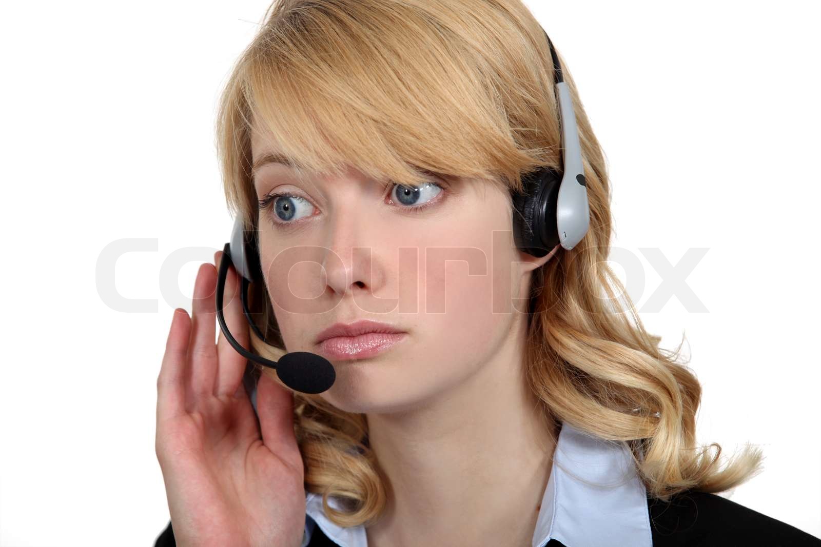 Call-center worker listening | Stock image | Colourbox