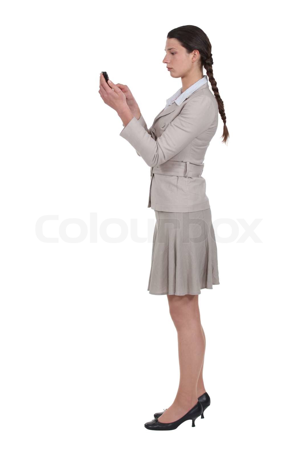 Woman receiving a text message | Stock image | Colourbox