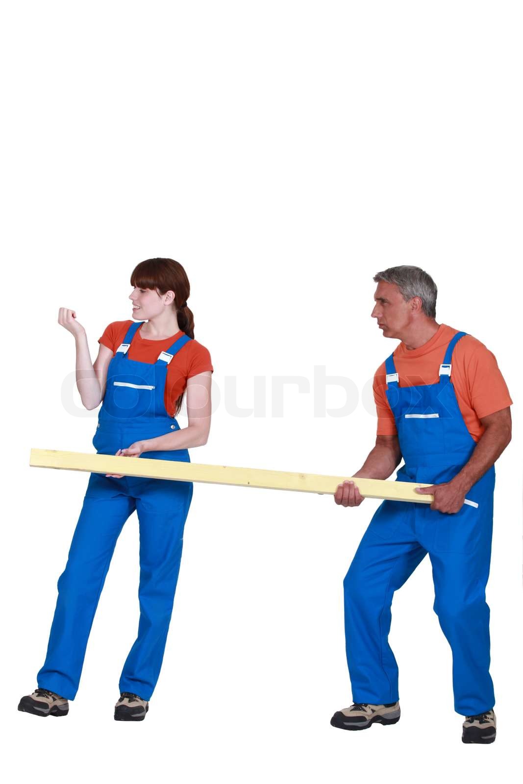 Labourer checking her nails while her colleague takes the brunt of a ...