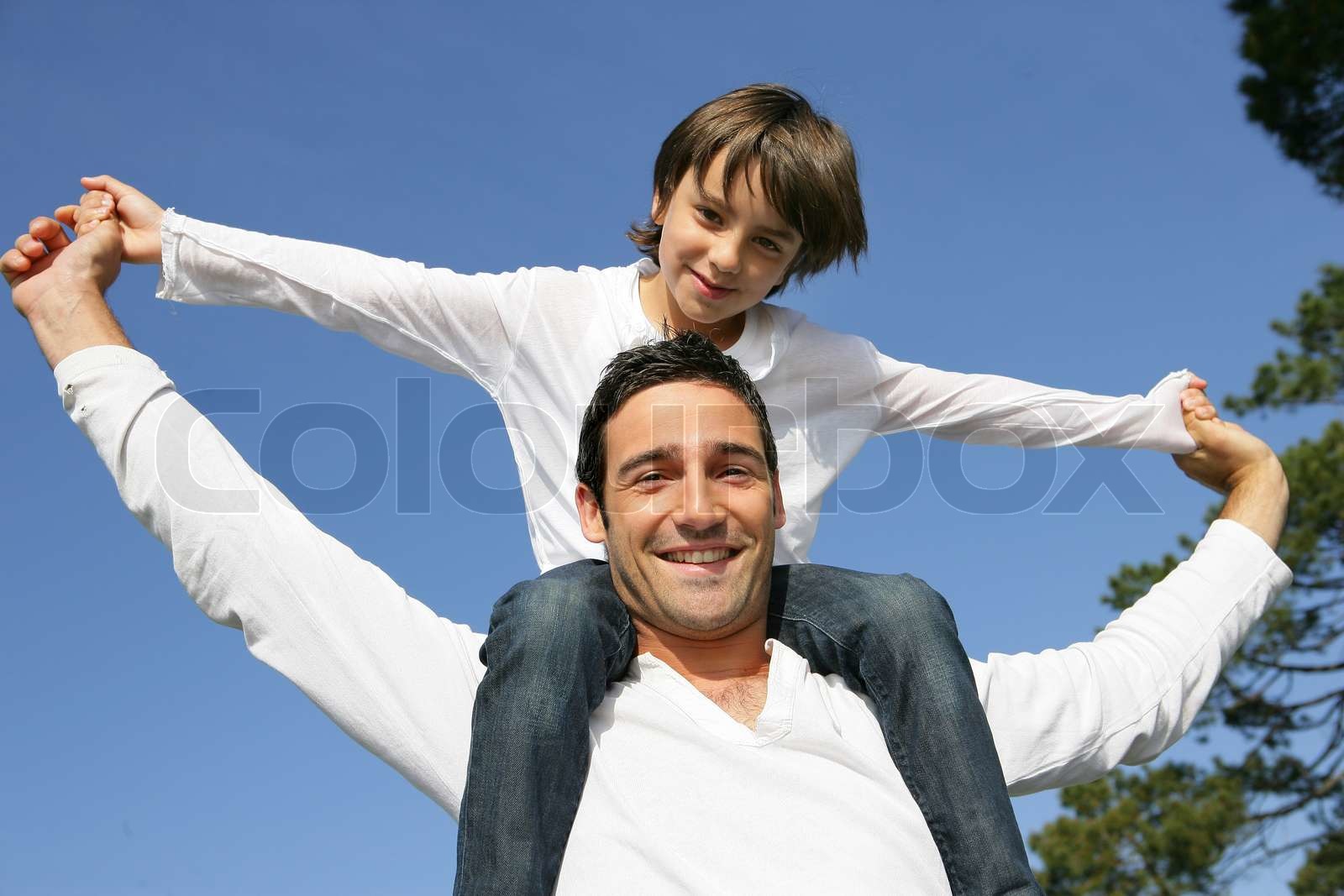 little boy on his father's shoulders | Stock image | Colourbox