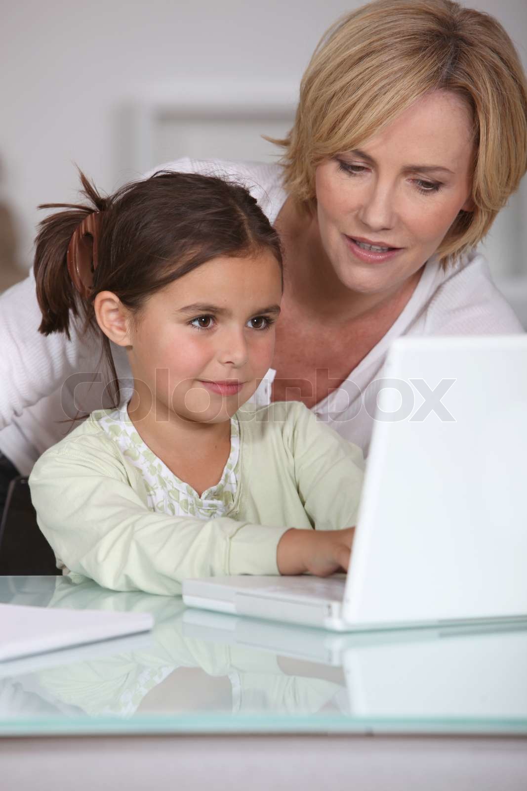 Mother teaching her little girl | Stock image | Colourbox