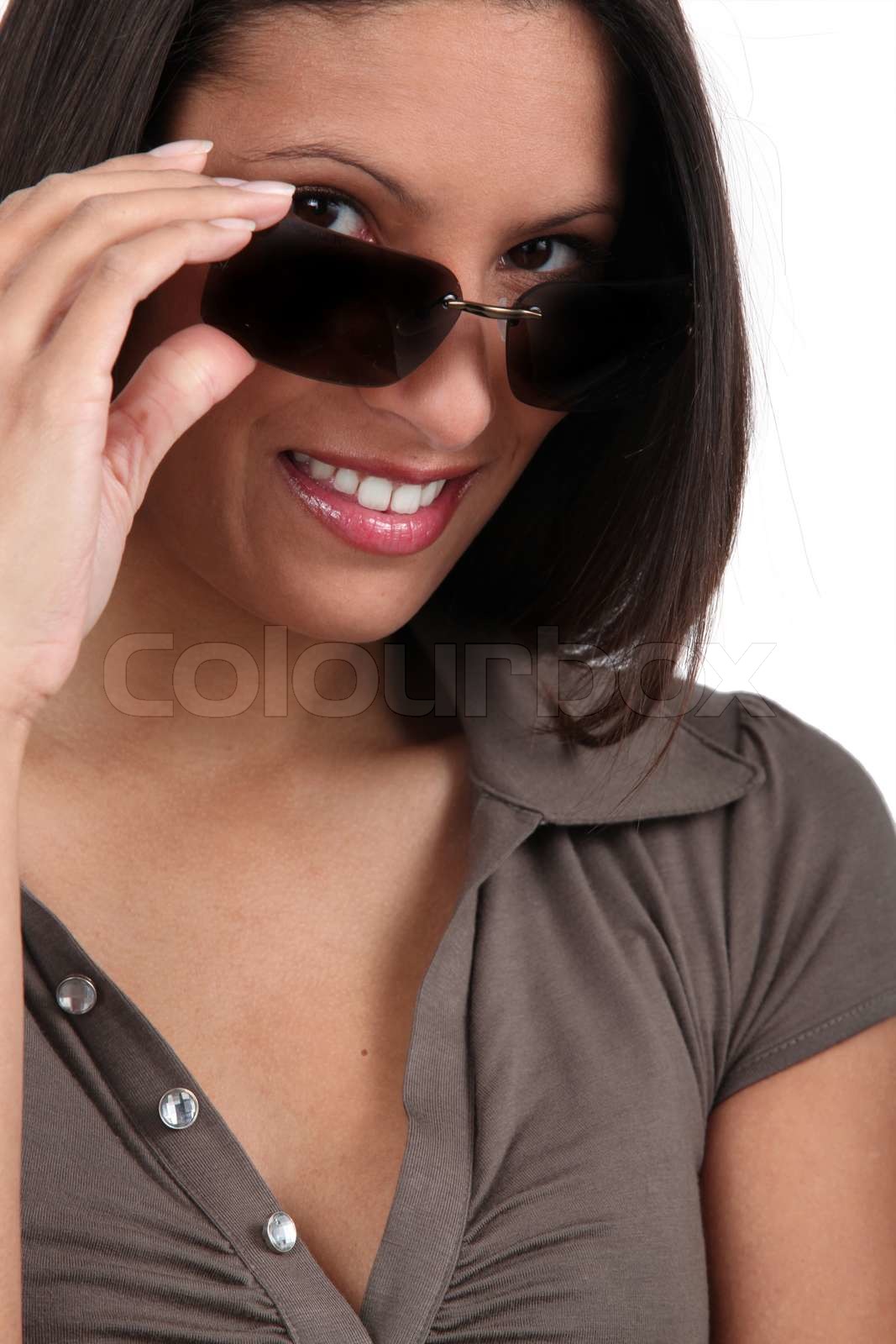 Woman peering over sunglasses | Stock image | Colourbox