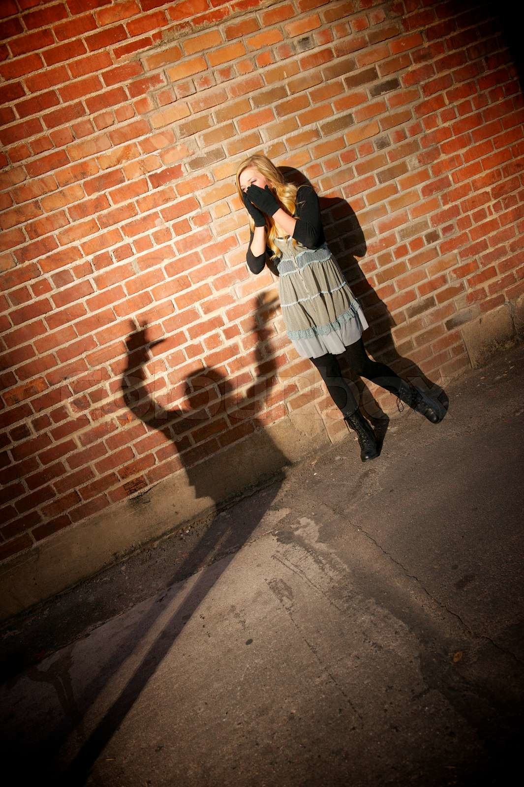 Teen Age Girl Screaming at Attacker's Shadow-Horizontal | Stock image ...
