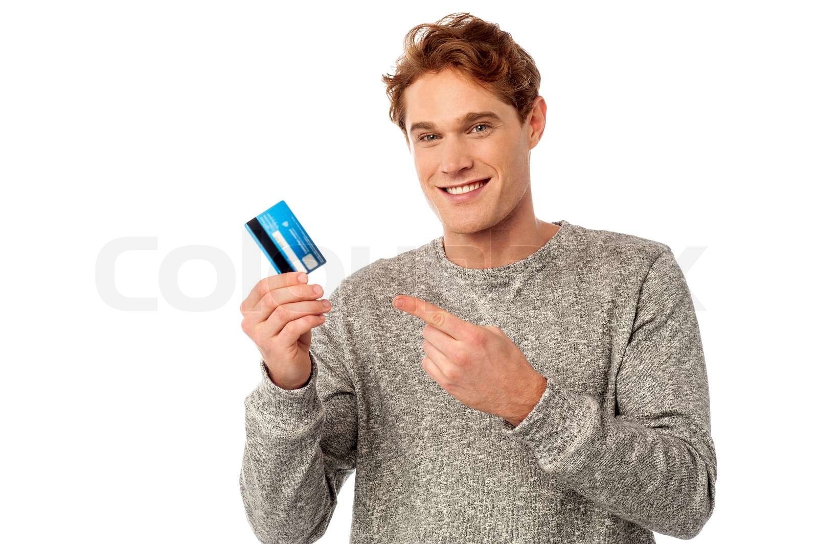 Guy pointing at his credit card | Stock image | Colourbox