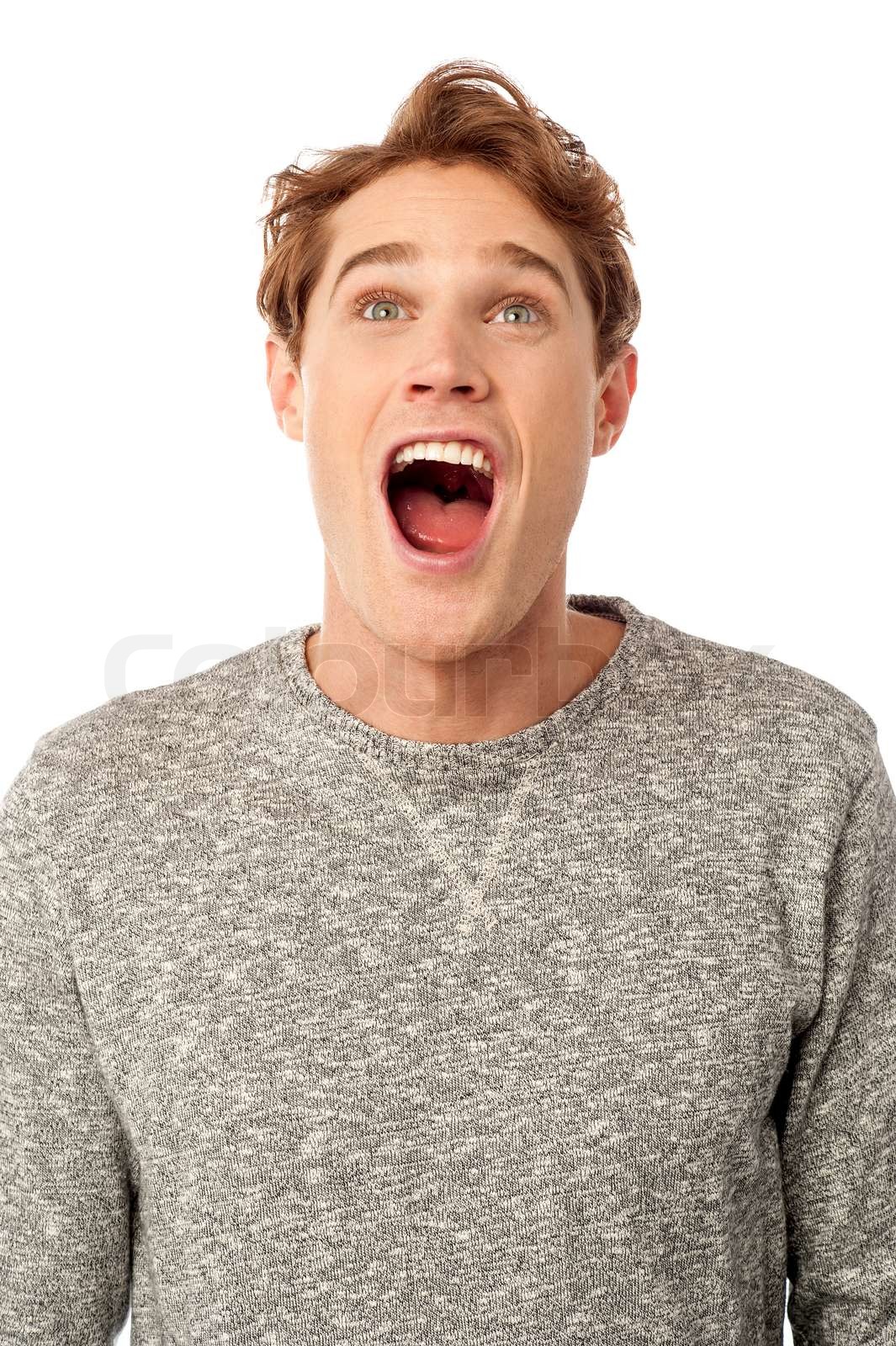 Amazed young guy with open mouth | Stock image | Colourbox
