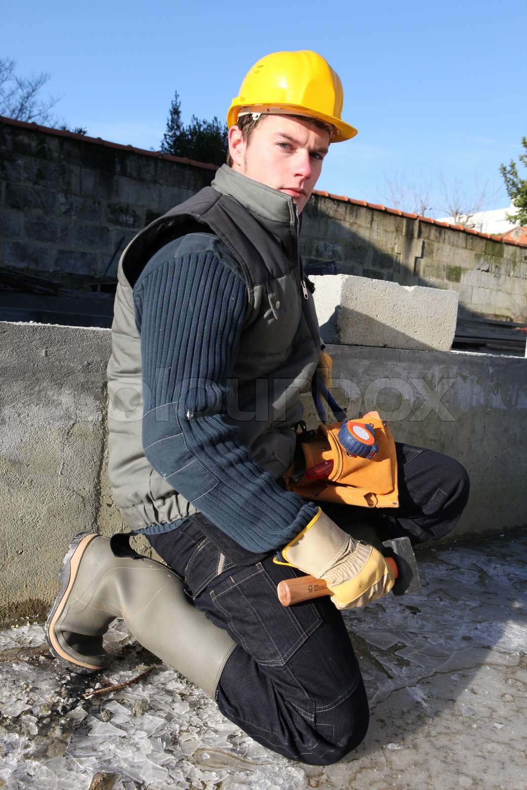 Mason working on building foundations | Stock image | Colourbox