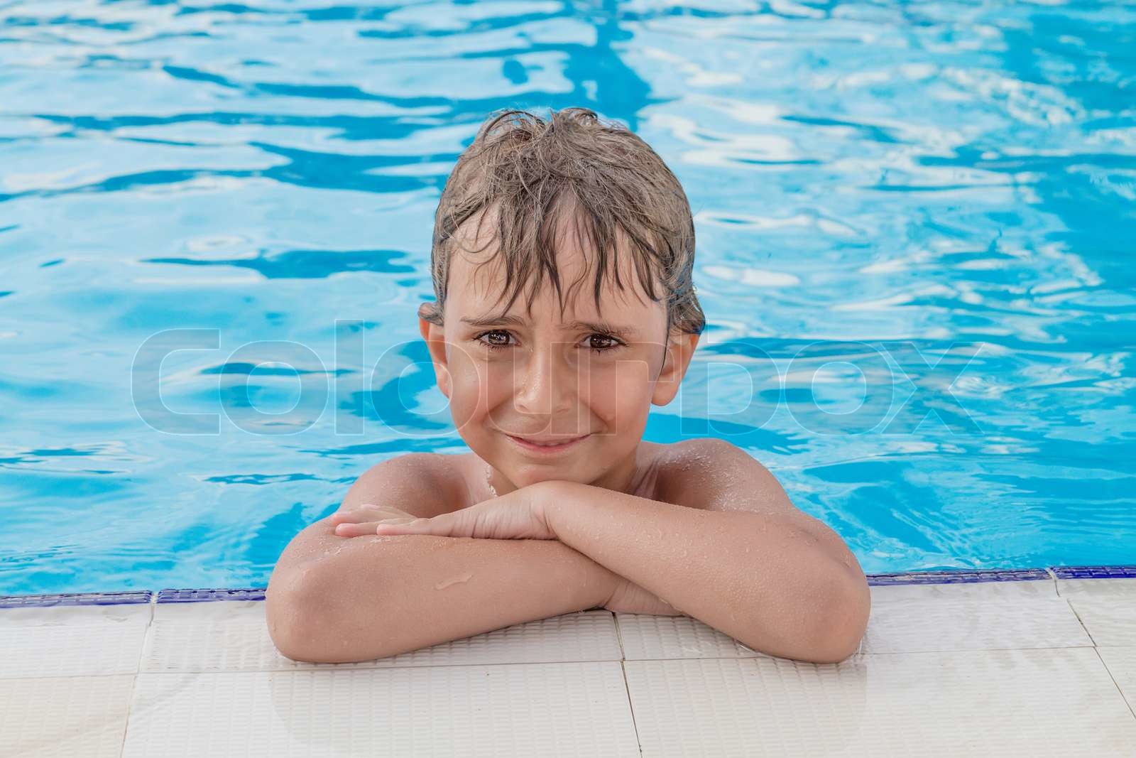 Portrait of the boy in the pool | Stock image | Colourbox