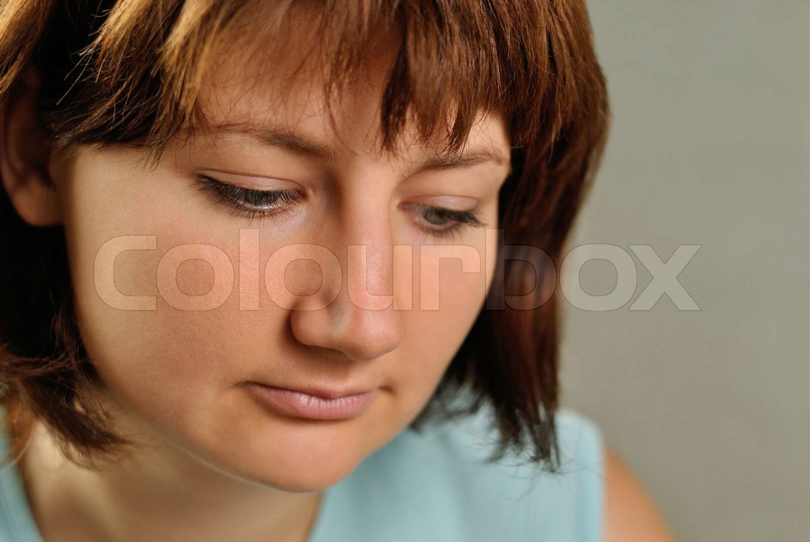 Close up face portrait of an attractive depressed despondent young ...