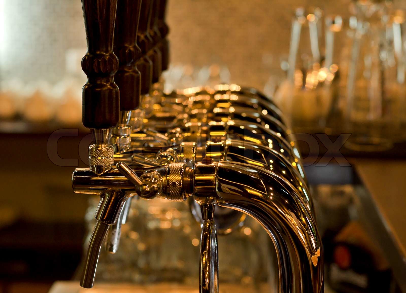 Row of beer taps in a pub or bar | Stock image | Colourbox