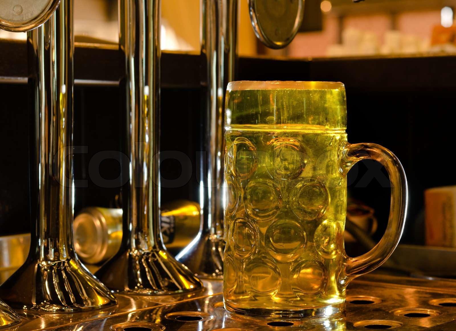 Large glass tankard of draught beer | Stock image | Colourbox