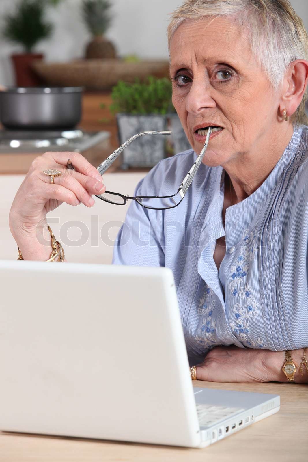 Confused old lady with laptop | Stock image | Colourbox