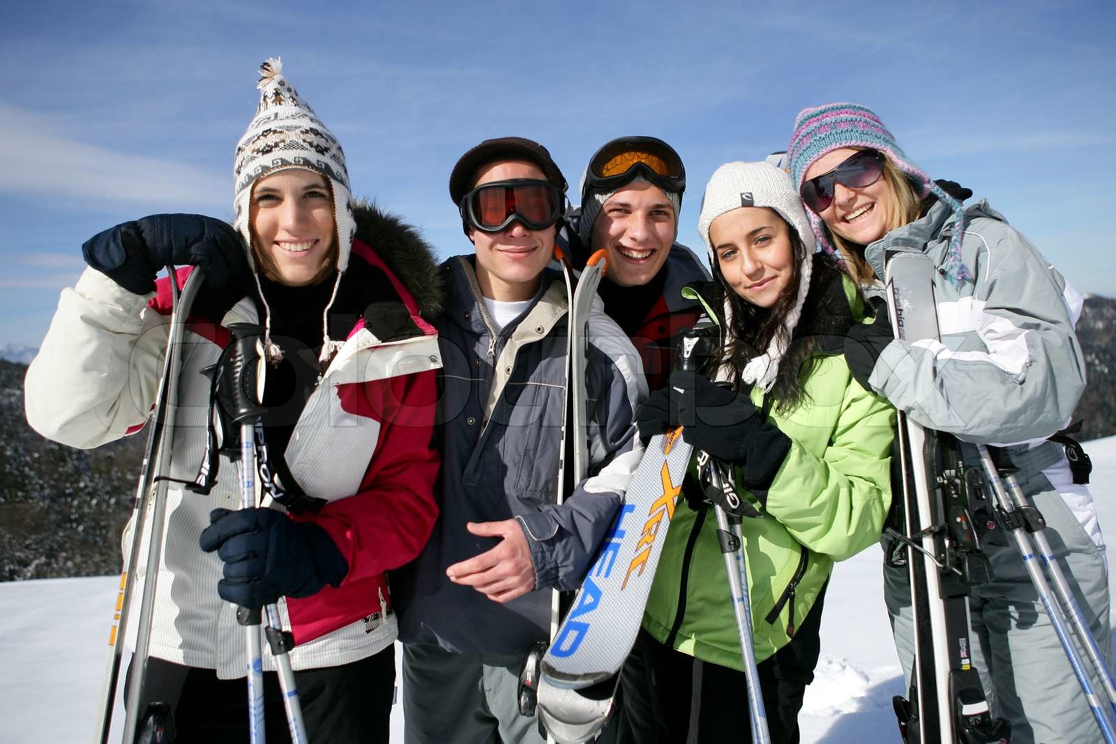 Group of friends with skis | Stock image | Colourbox