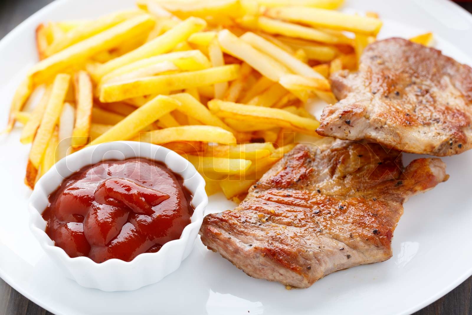 Fried steak with french fries | Stock image | Colourbox