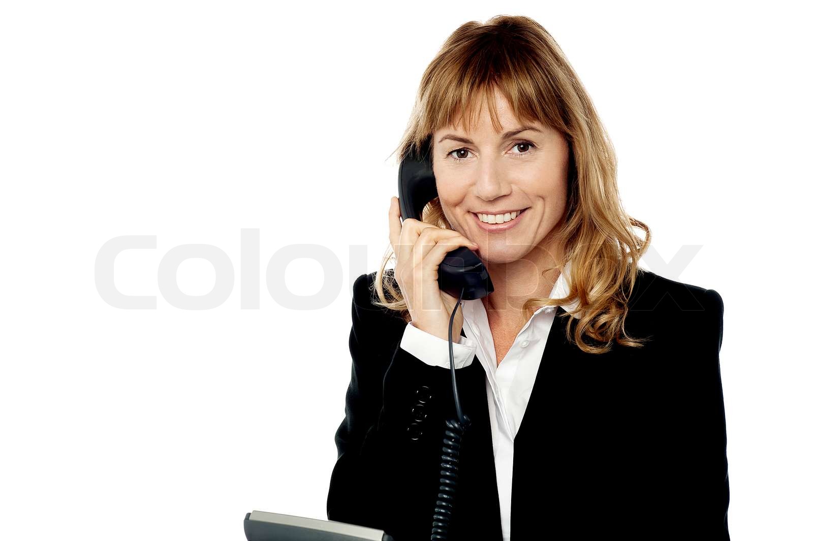 Professional woman answering phone call | Stock image | Colourbox