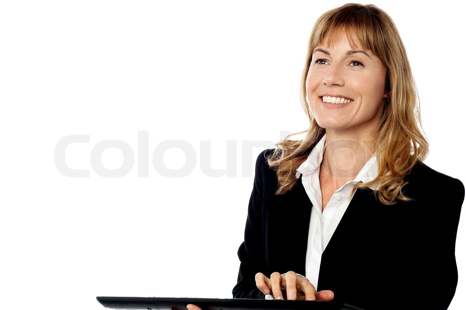 Cheerful corporate lady at work | Stock image | Colourbox