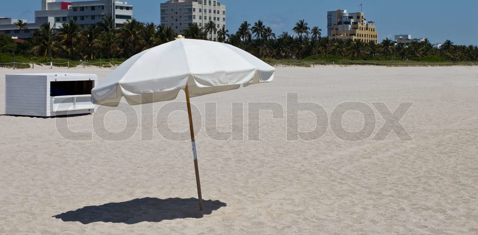 Sun umbrellas on a sandy beach | Stock image | Colourbox