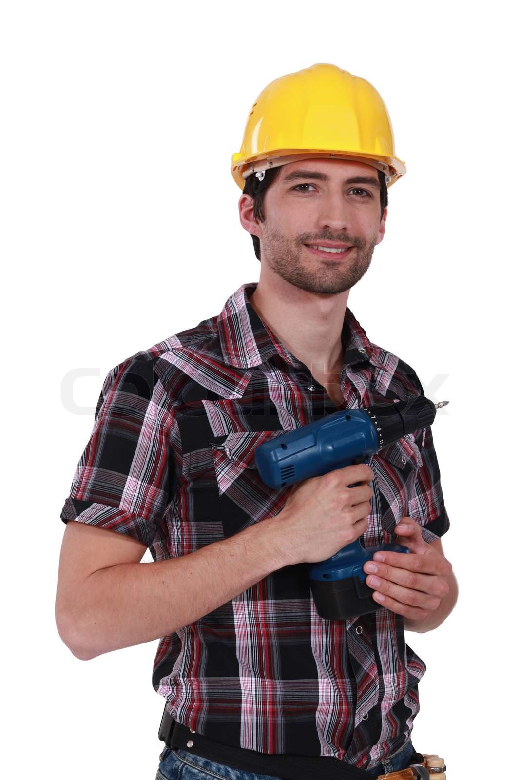 Junge Handwerker halten eine Bohrmaschine | Stock Bild | Colourbox