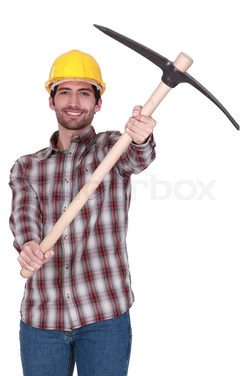 Tradesman holding up a pickaxe | Stock image | Colourbox