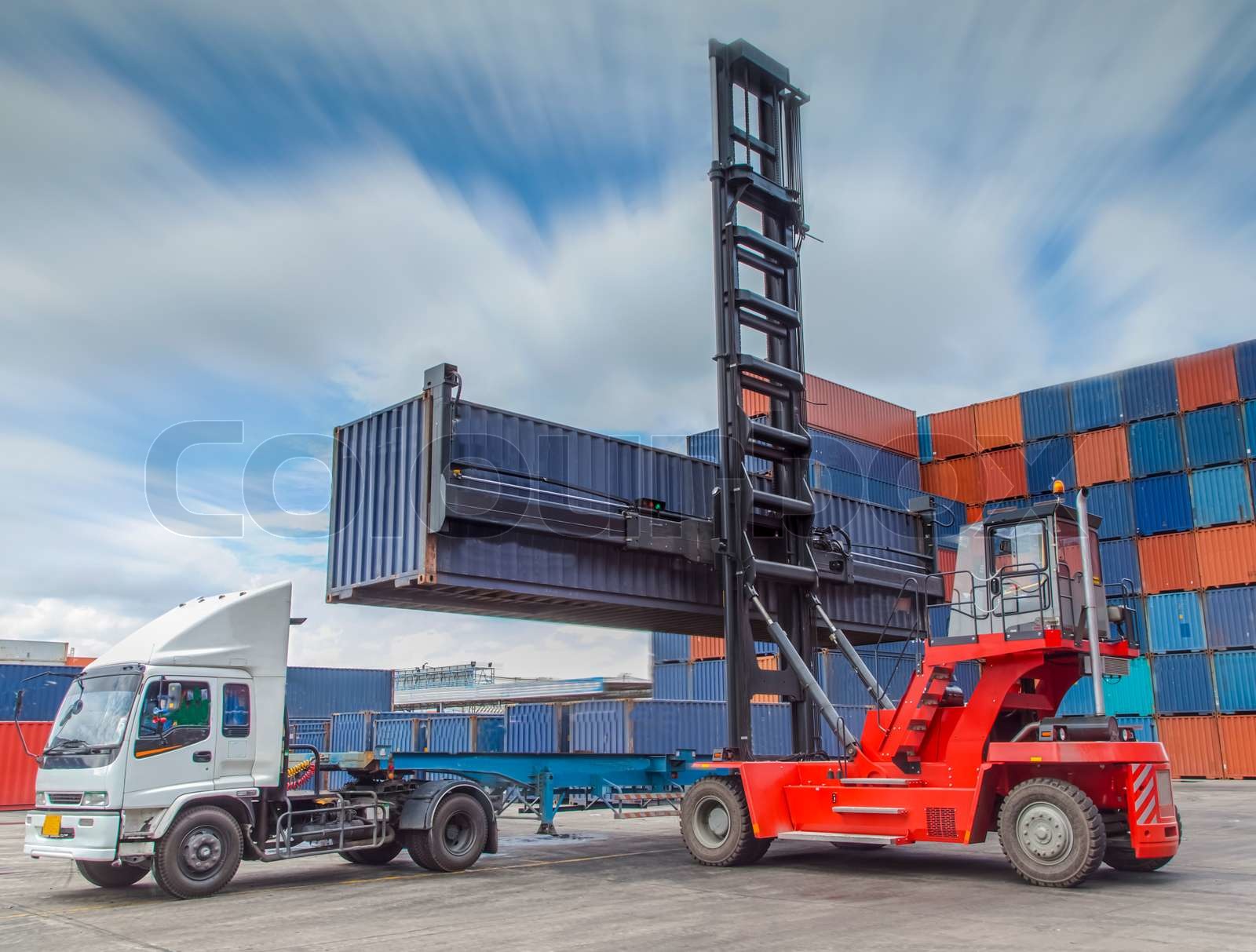 Crane lifter handling container box loading | Stock image | Colourbox