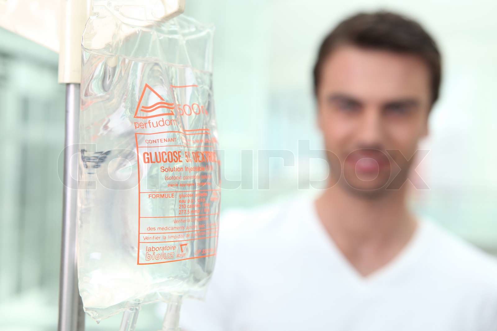 Man on an intravenous drip | Stock image | Colourbox