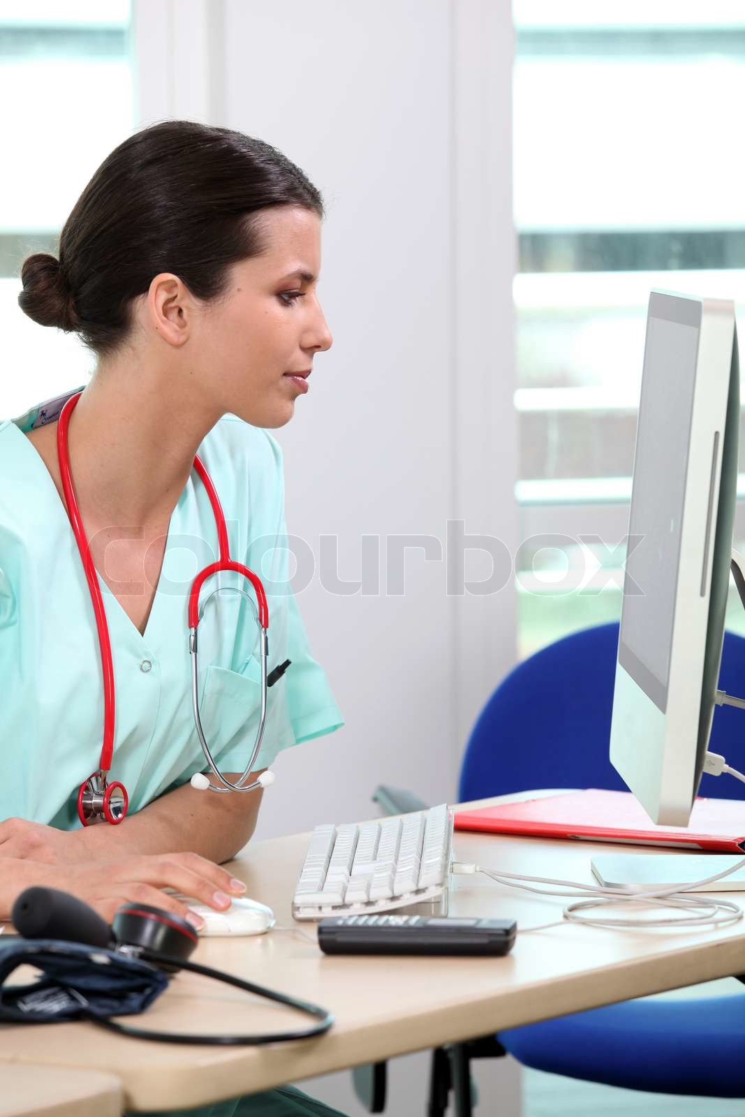 Nurse using a computer | Stock image | Colourbox