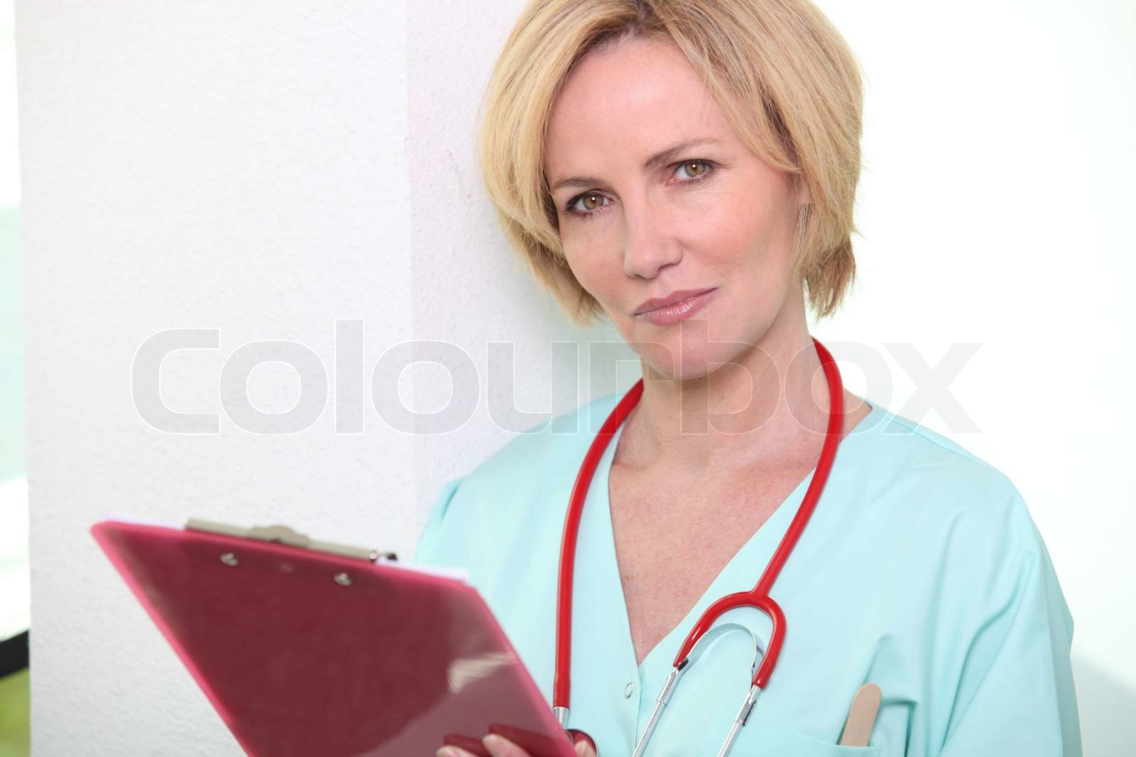 Nurse taking notes | Stock image | Colourbox