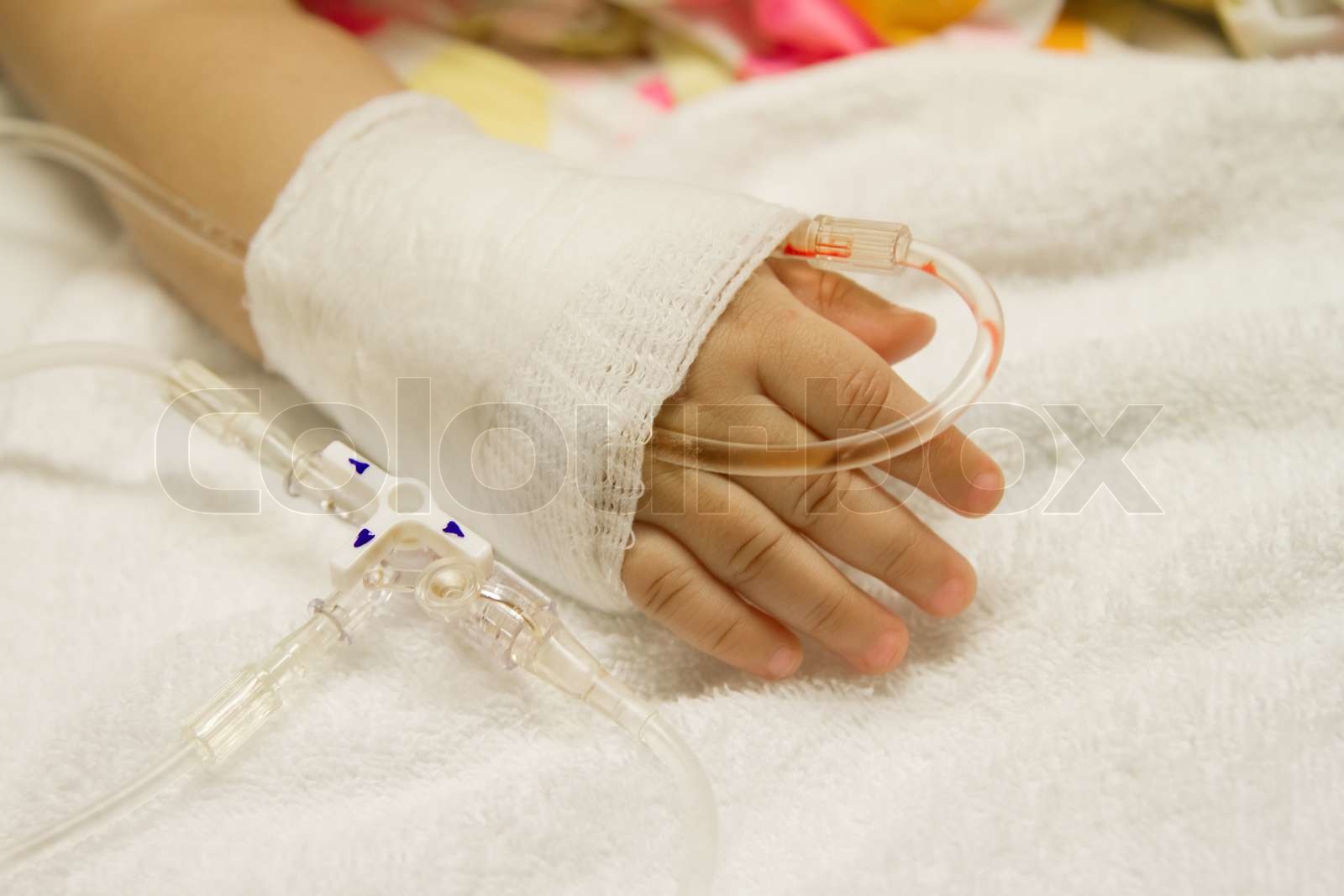 Children's patientin the hospital with saline intravenous iv drip ...