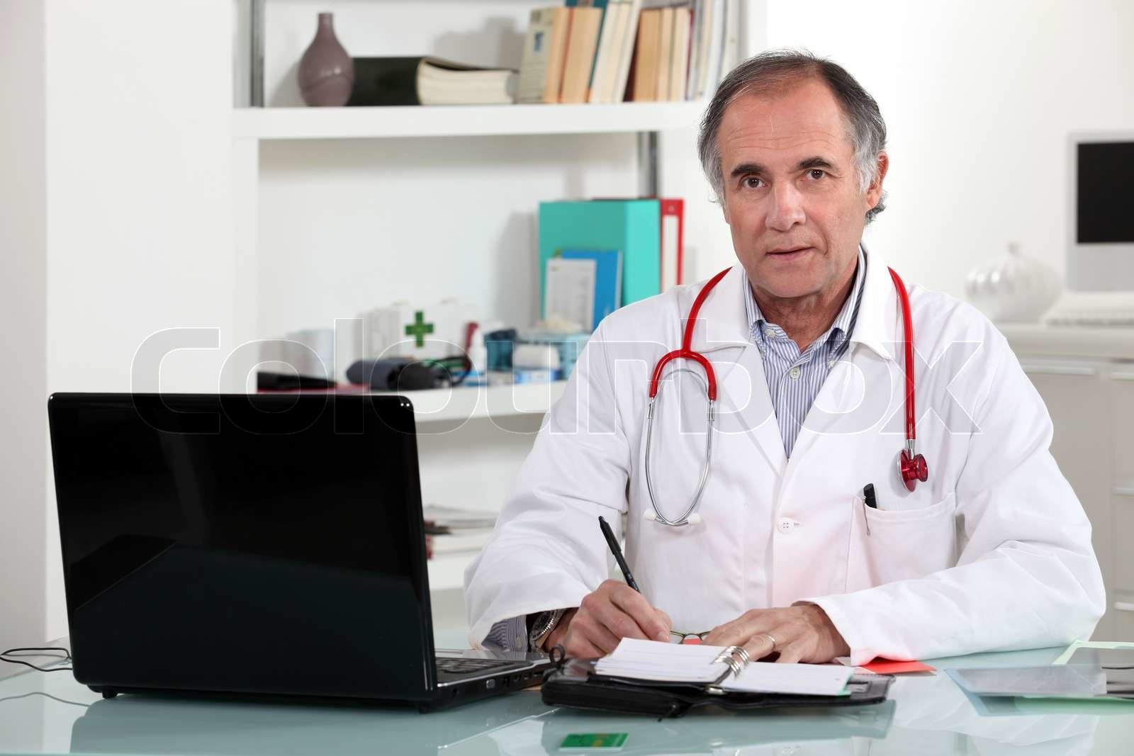 doctor prescribing medication | Stock image | Colourbox