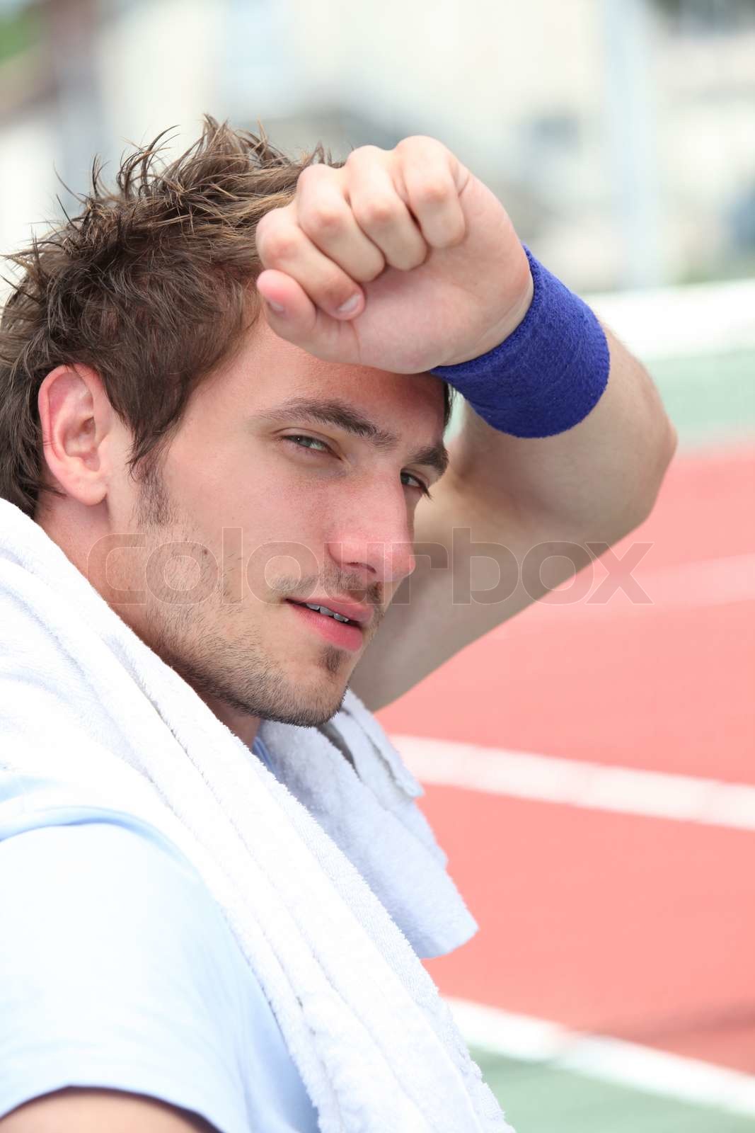Male tennis player tired after match | Stock image | Colourbox