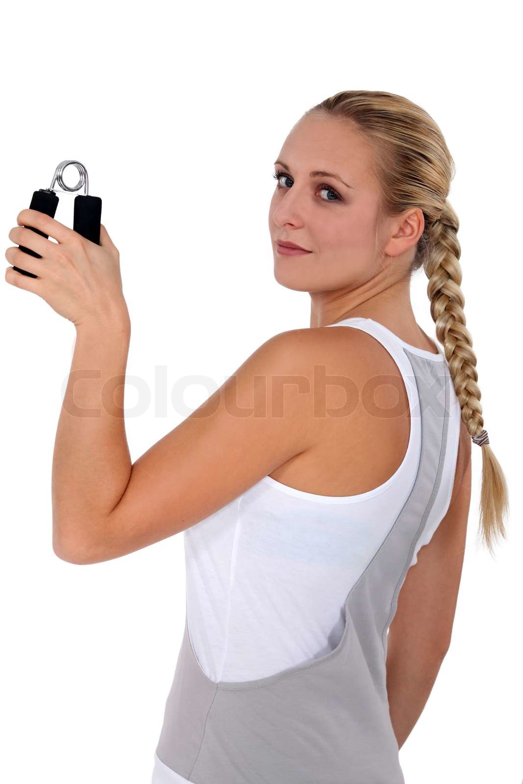 Woman holding grippers | Stock image | Colourbox