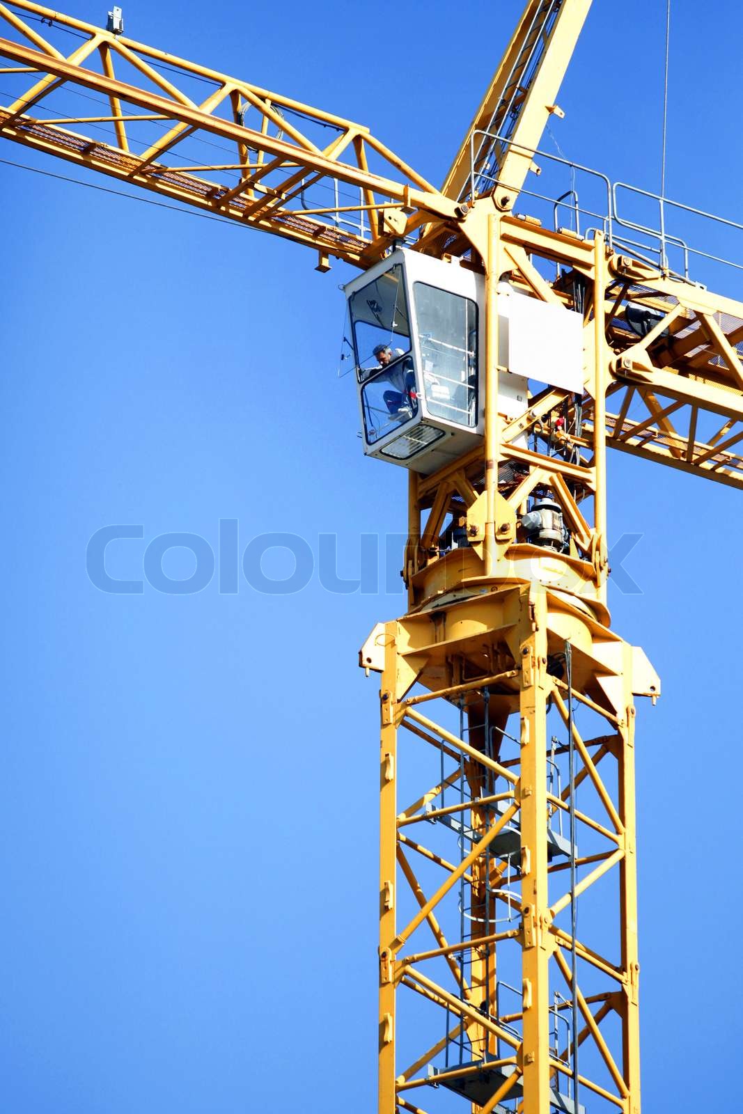 Man operating a crane | Stock image | Colourbox