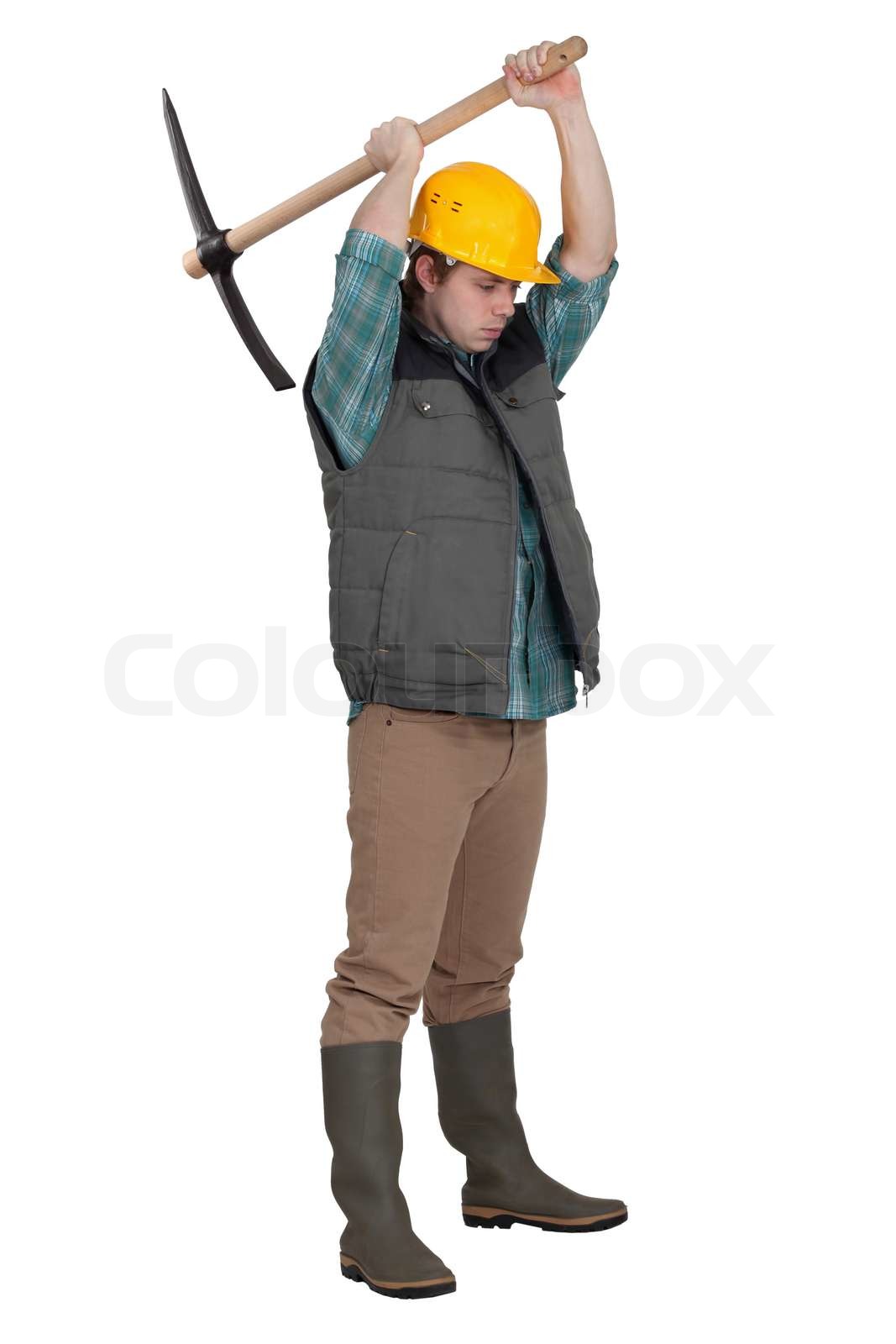 man using pickaxe, studio shot | Stock image | Colourbox