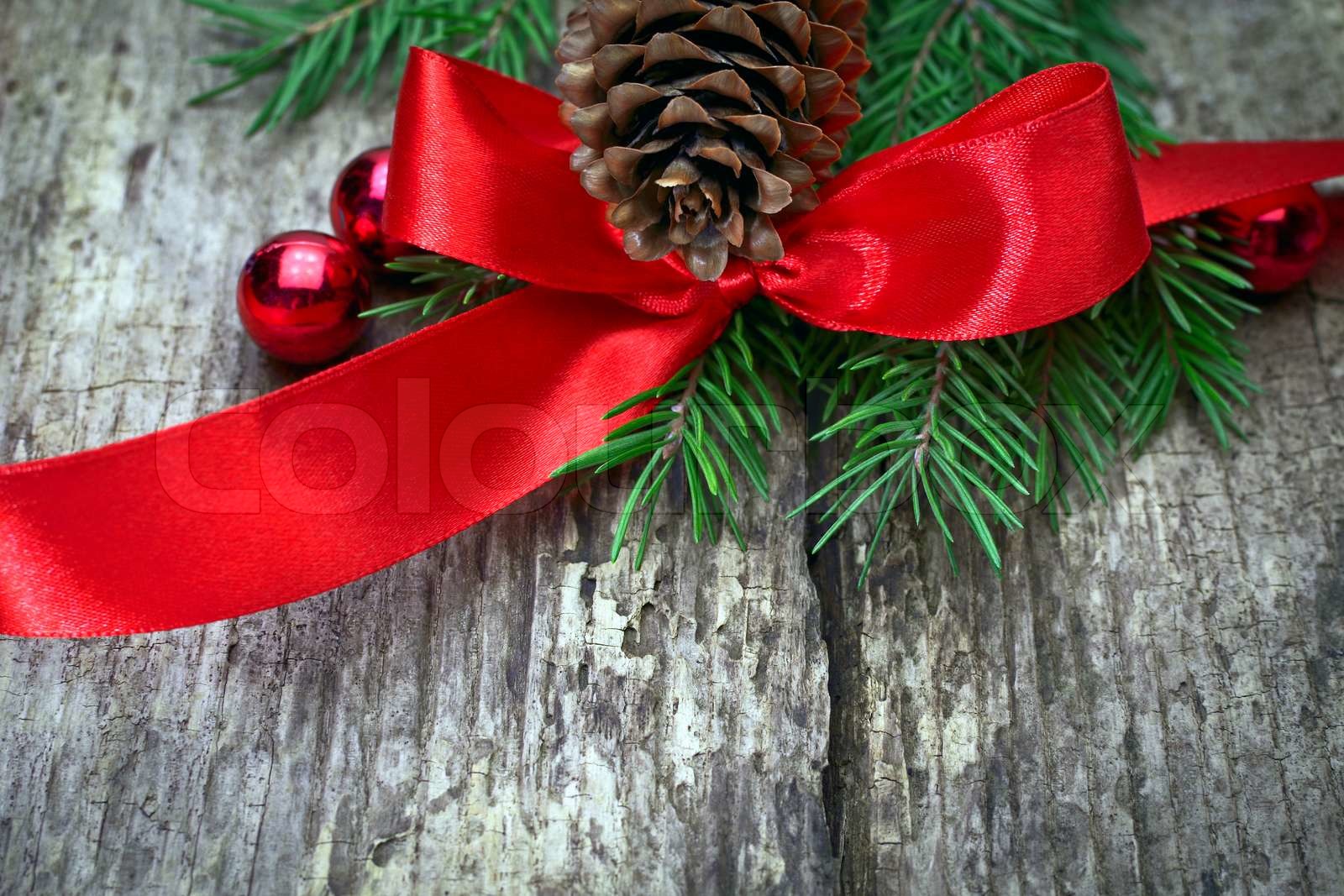Red bow with pine cones | Stock image | Colourbox