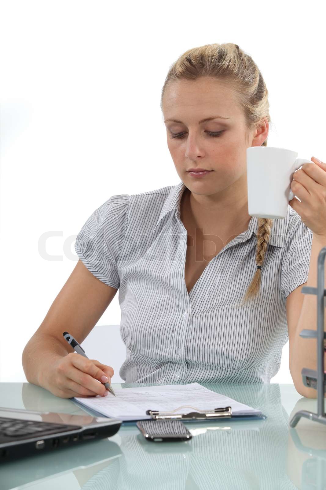 Secretary filling in paperwork | Stock image | Colourbox