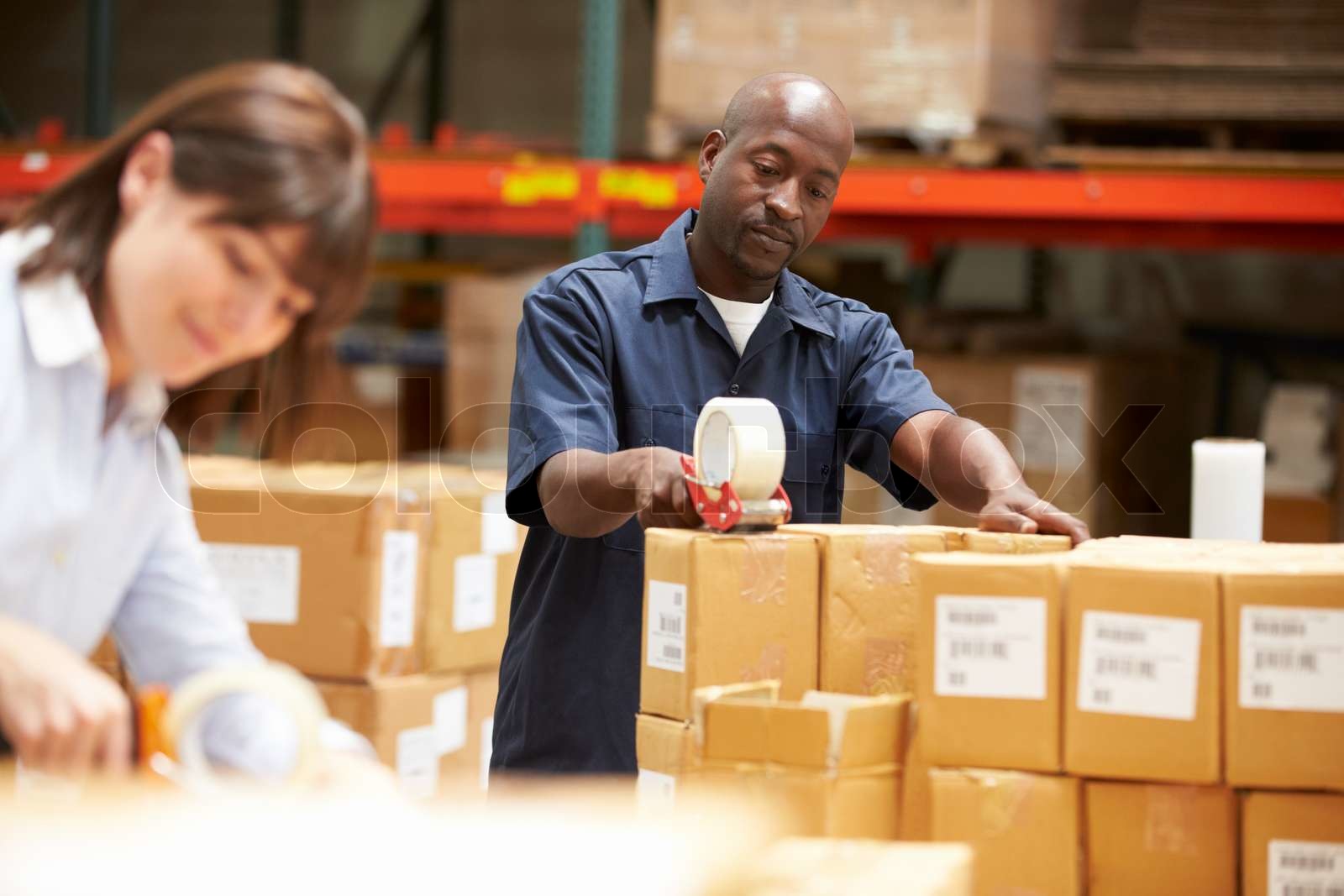 Workers In Warehouse Preparing Goods For Dispatch | Stock image | Colourbox