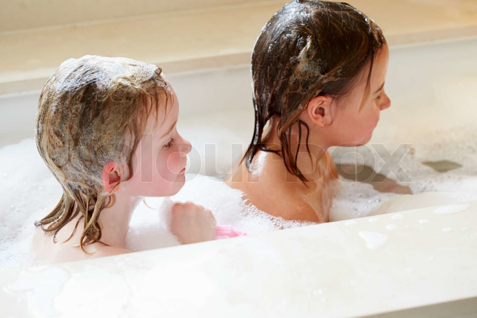 Two Girls Sharing Bubble Bath | Stock image | Colourbox