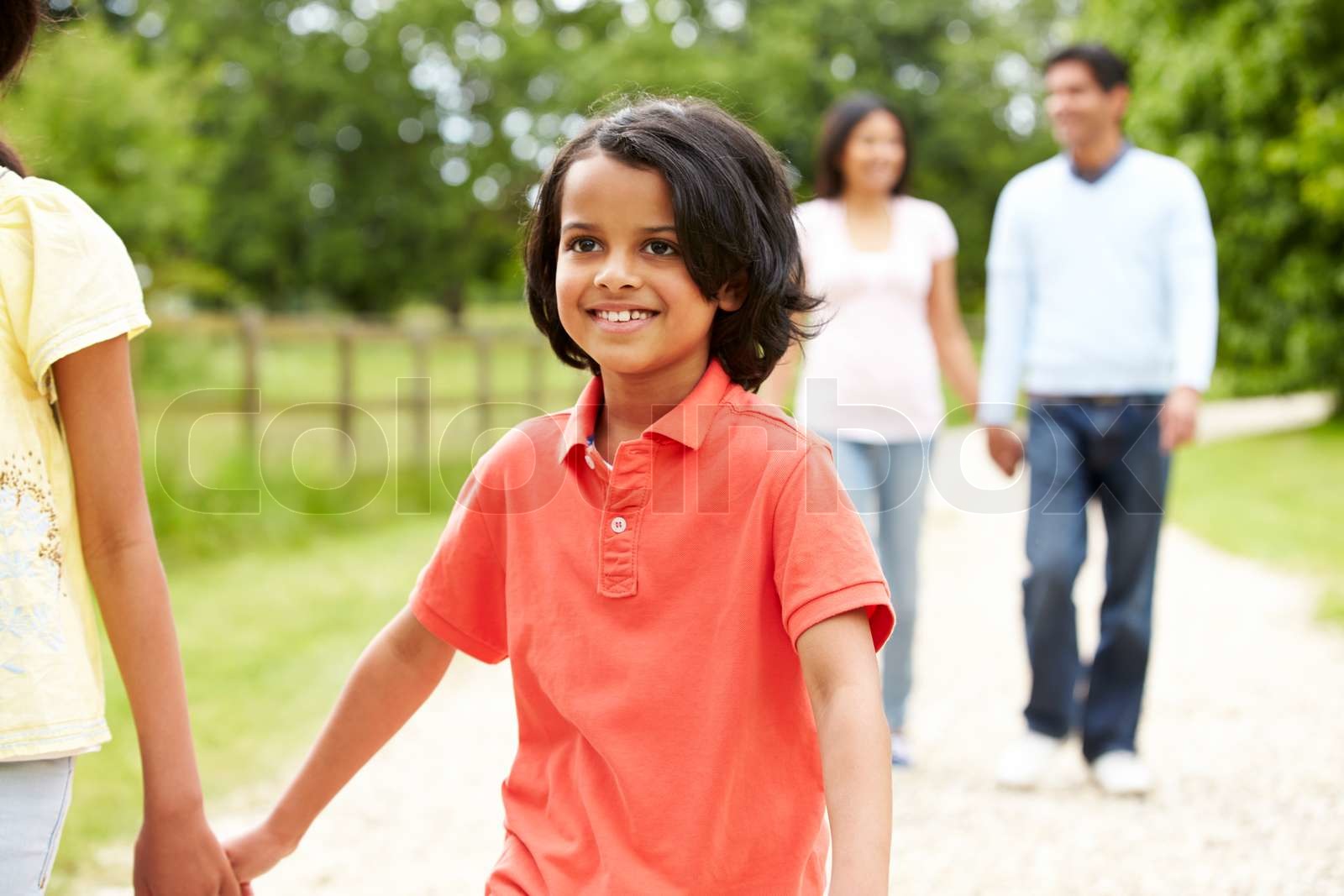 Indian Family Walking In Countryside | Stock image | Colourbox