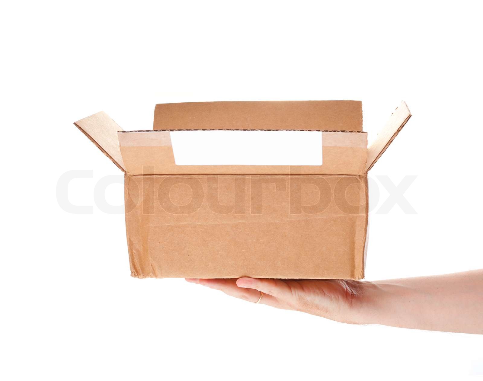 Postpaket in Hand auf weißem Hintergrund | Stock Bild | Colourbox