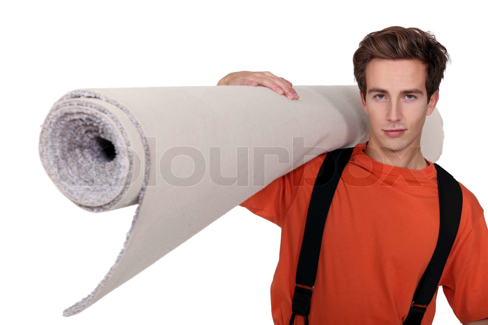 Man carrying carpet | Stock image | Colourbox