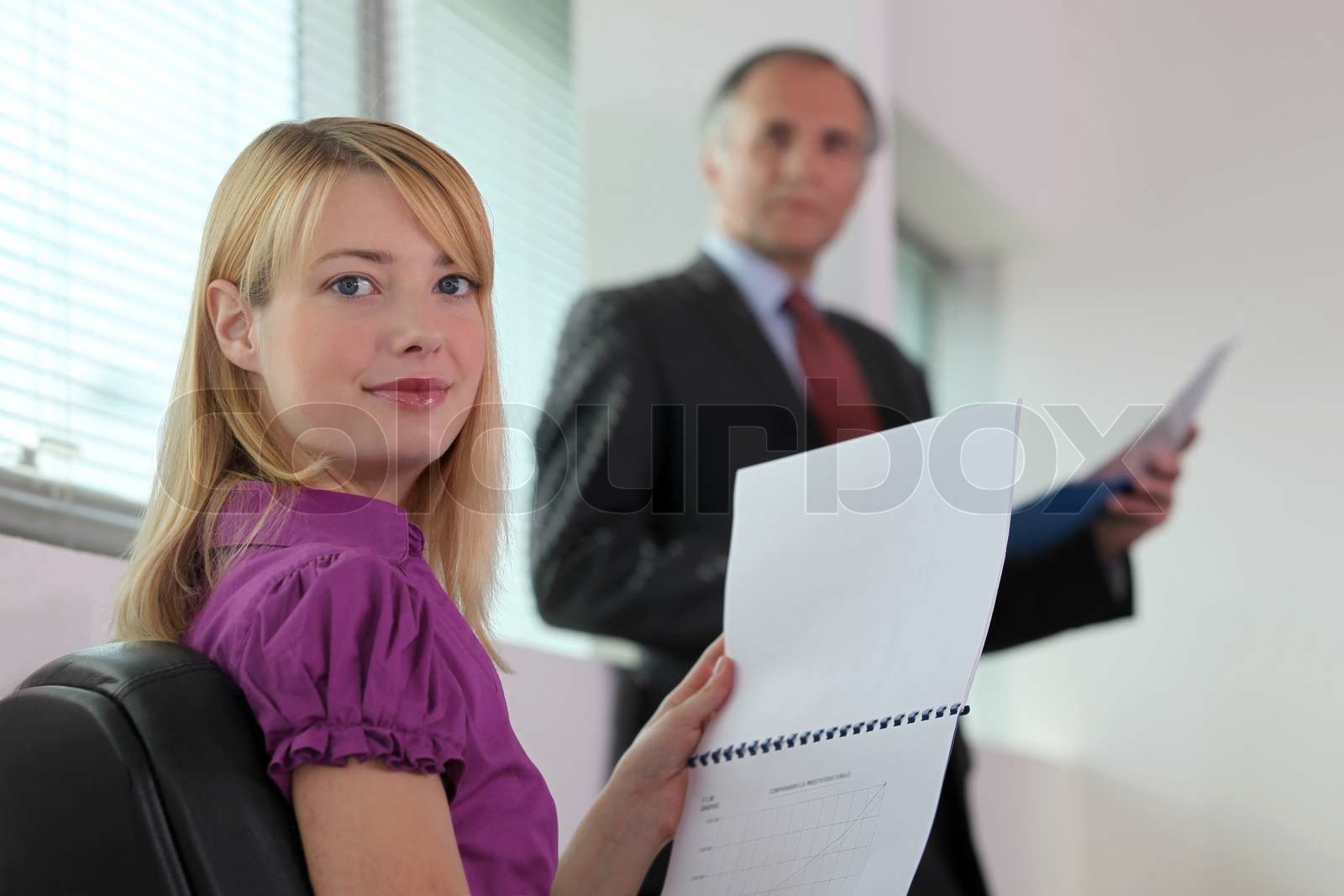 Secretary processing paperwork | Stock image | Colourbox
