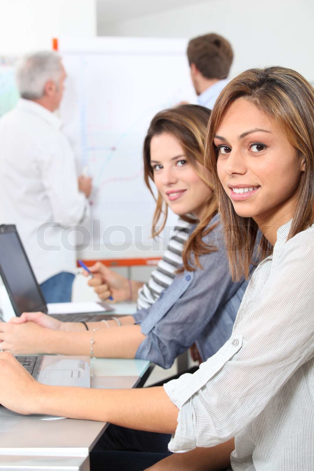 Women smiling in classroom | Stock image | Colourbox