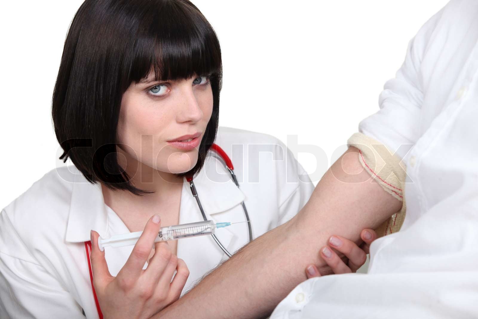 Doctor with needle | Stock image | Colourbox