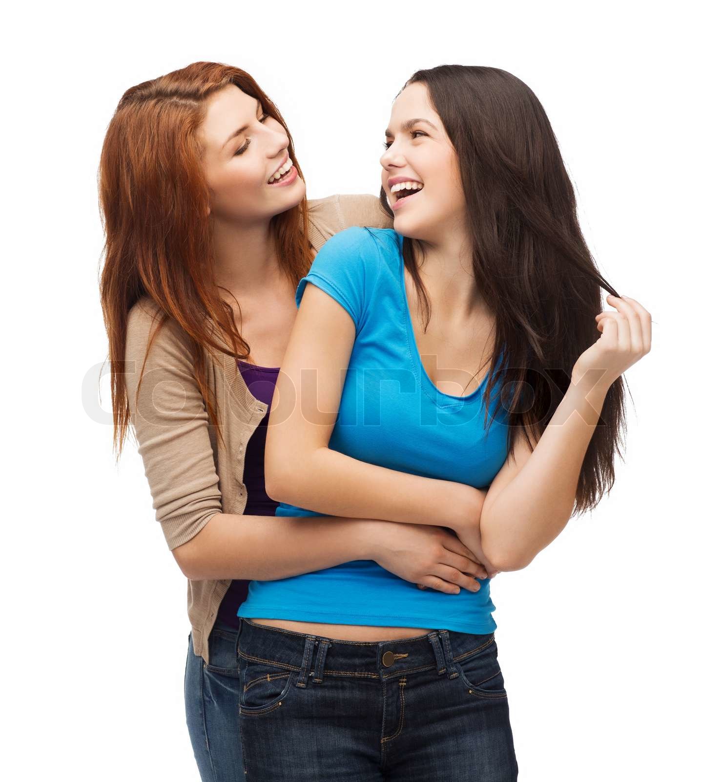 two laughing girls looking at each other | Stock image | Colourbox