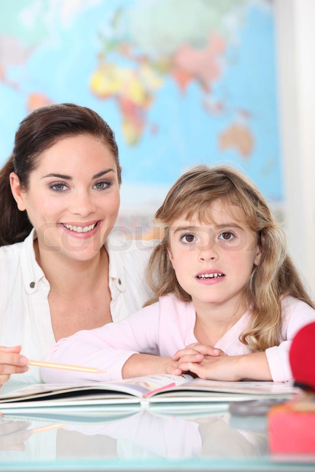 Teacher and girl in school | Stock image | Colourbox