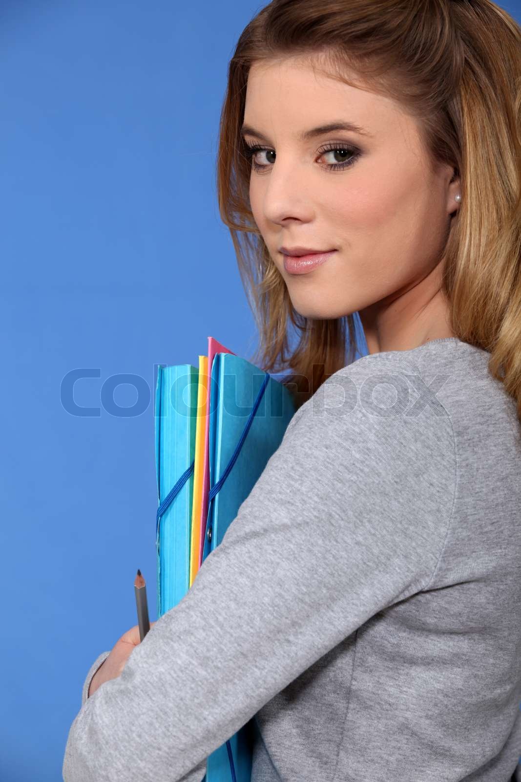 Studentin Holding Ordner | Stock Bild | Colourbox