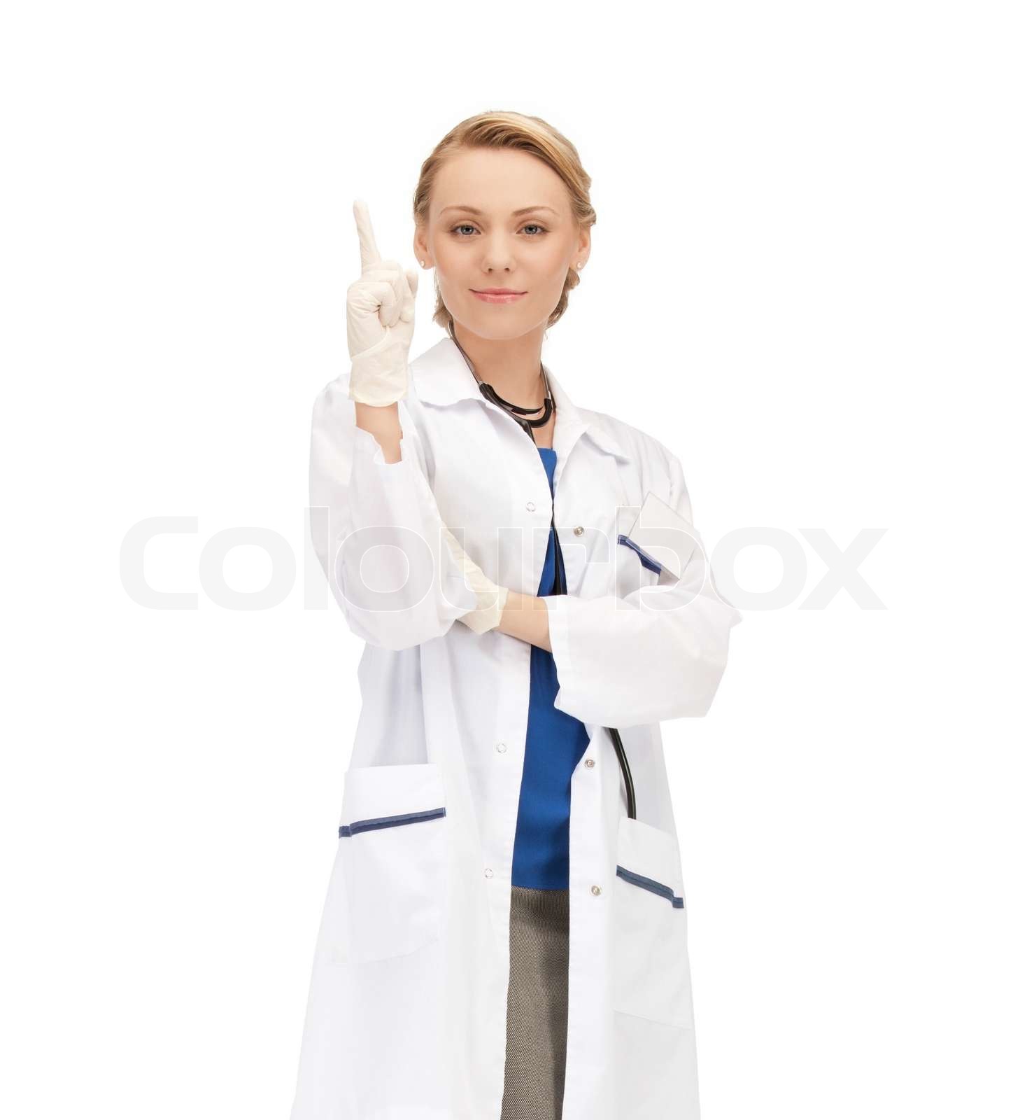 smiling female doctor pointing her finger up | Stock image | Colourbox