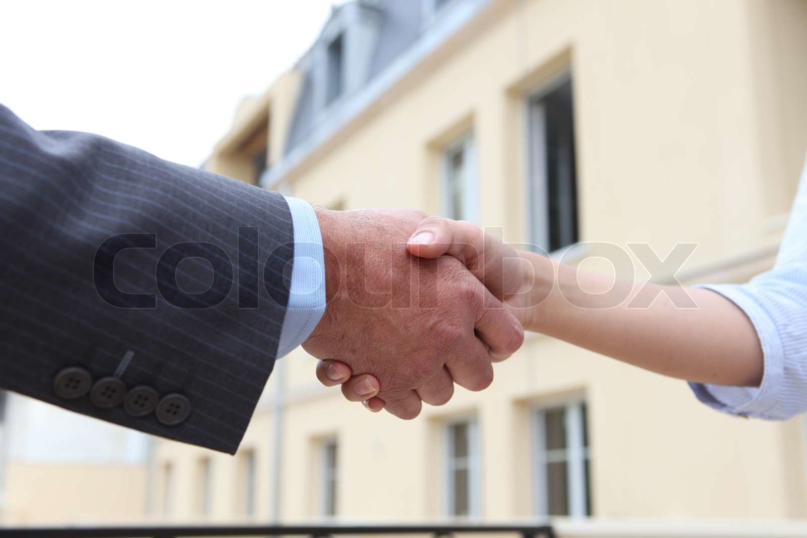 Man and woman shaking-hands | Stock image | Colourbox
