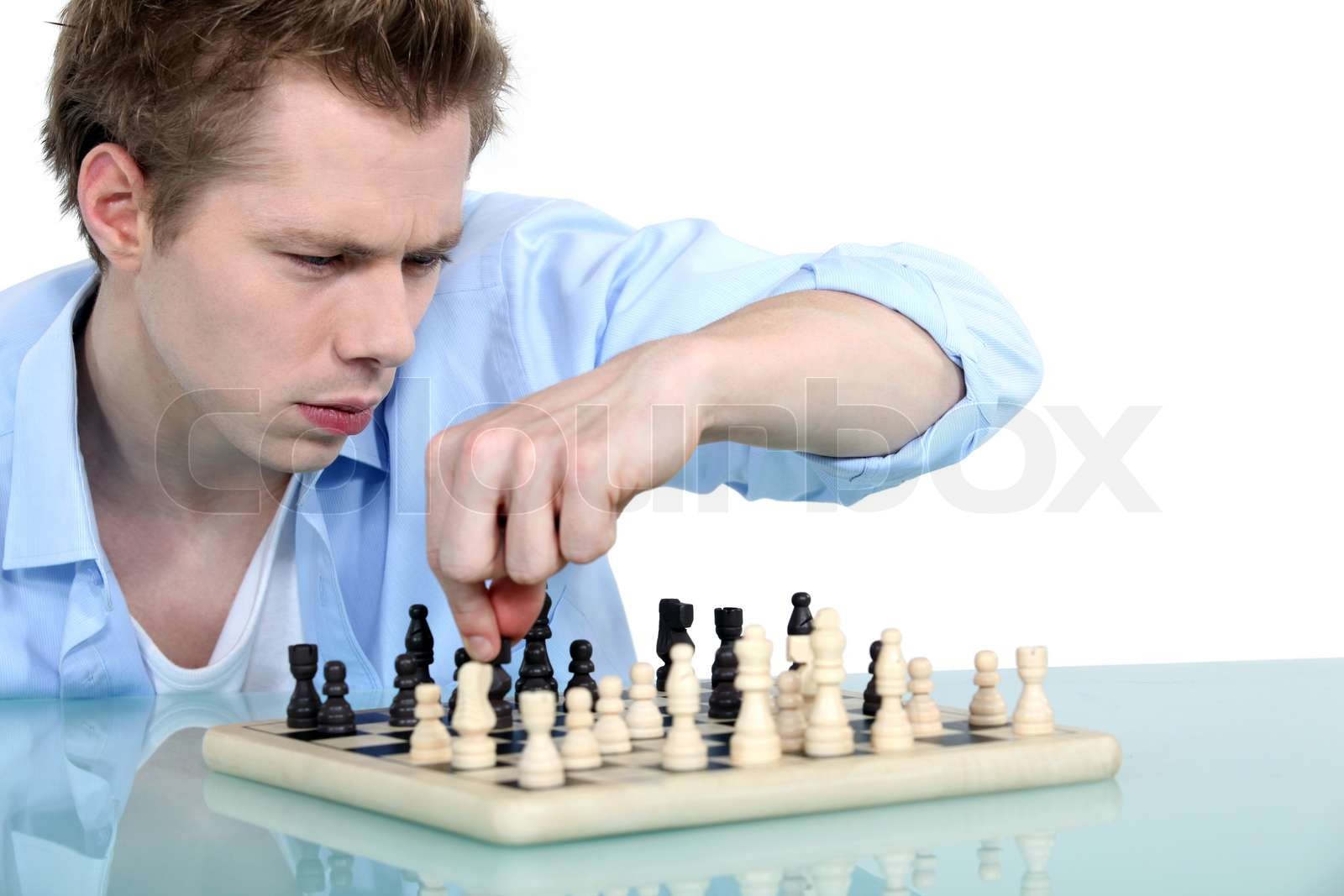 Man playing chess alone | Stock image | Colourbox